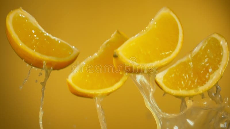 Close-up of Fresh Oranges Bouncing with the Splashes of the Orange ...