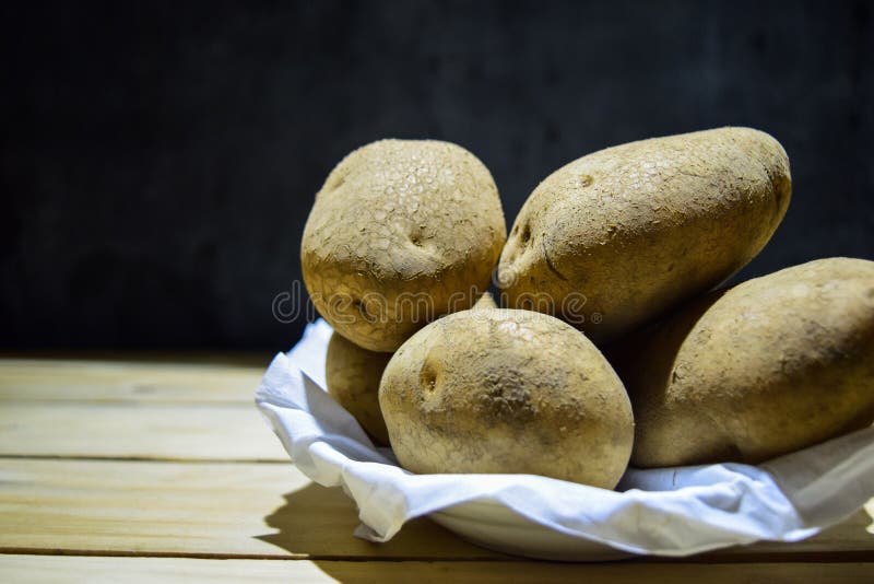 Close-up Fresh Potatoes Lying on Wooden Table Stock Photo - Image of ...