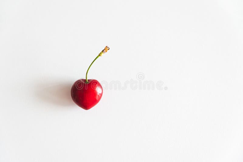 Close-up Fresh Red Cherry of Heart Shape on White Table. Top View Stock ...