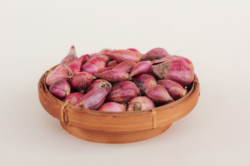 Close Up of Fresh Shallots in a Woven Bamboo Container on an Background ...