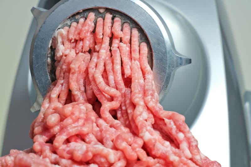 Freshly Ground Pork Minced in an Electric Meat Grinder Stock Photo ...