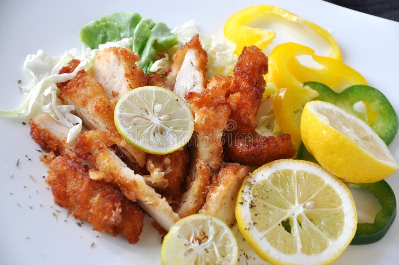 Close Up Fried Chicken with Fresh Lime and Lemon Stock Photo - Image of ...