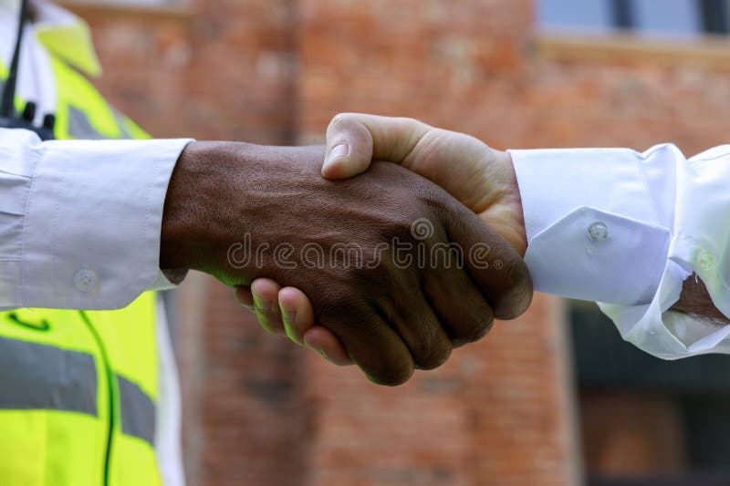 Close Up of Friendly Handshake between Caucasian Architect and African ...