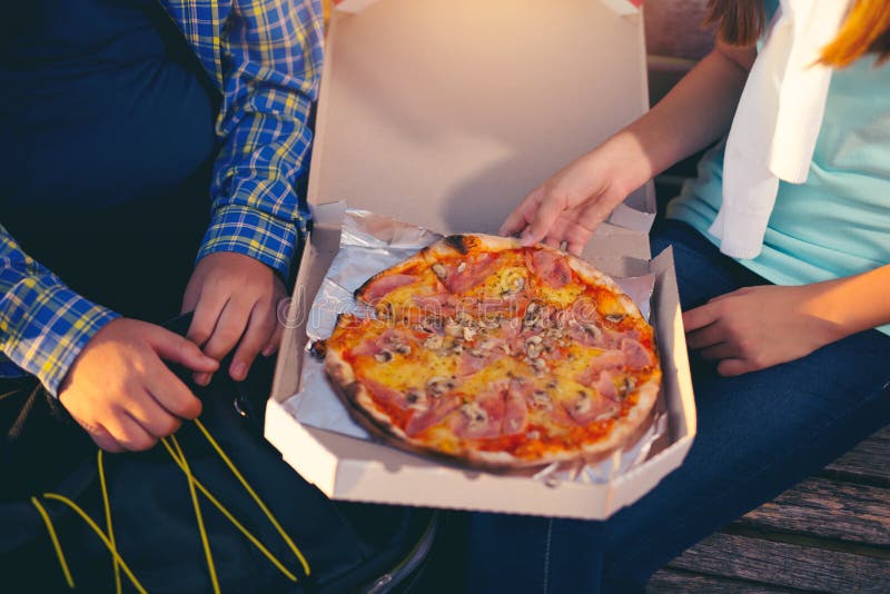 Close Up of Friends Hands Eating Pizza from Cardboard Box Stock Photo ...
