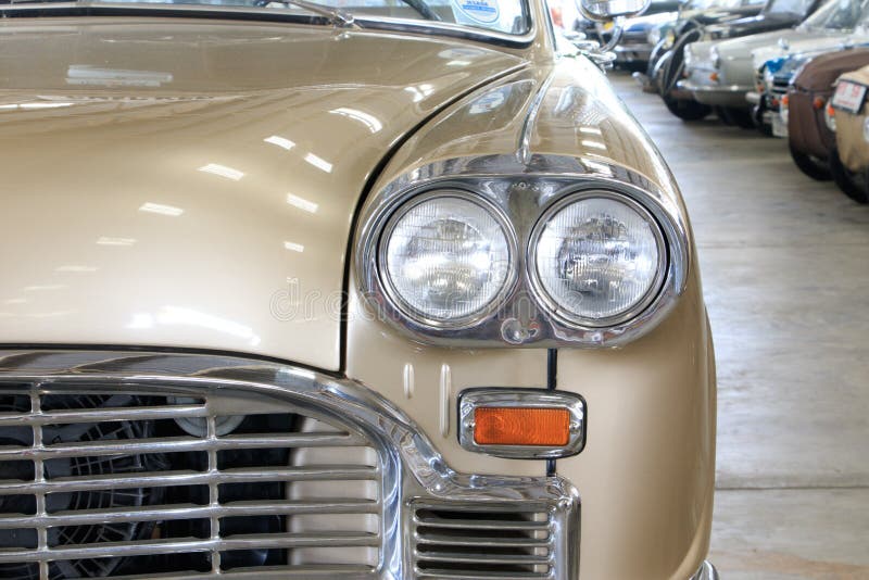 Close Up of Front Light Details of a Gold Vintage Car Stock Photo ...