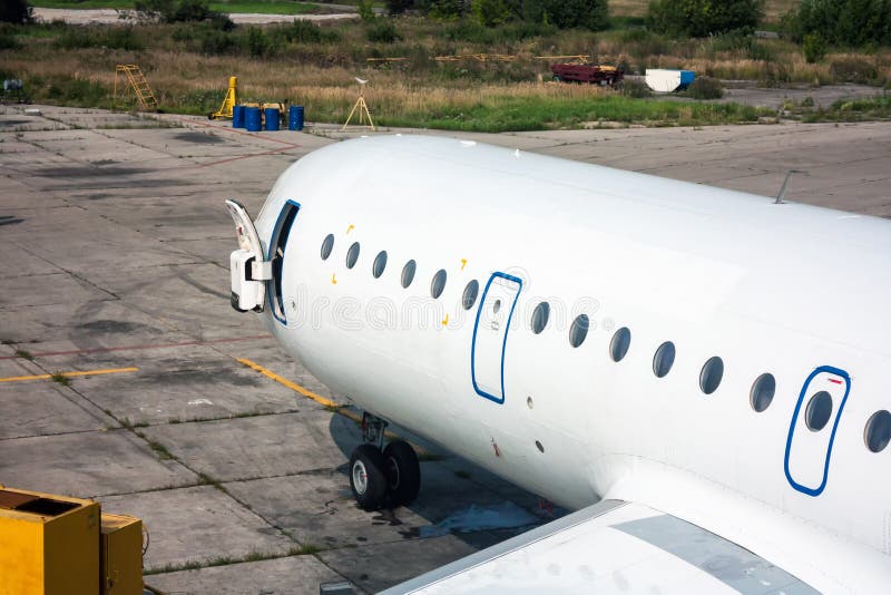 Close-up of the Front of a Passenger Aircraft with an Open Door on the ...
