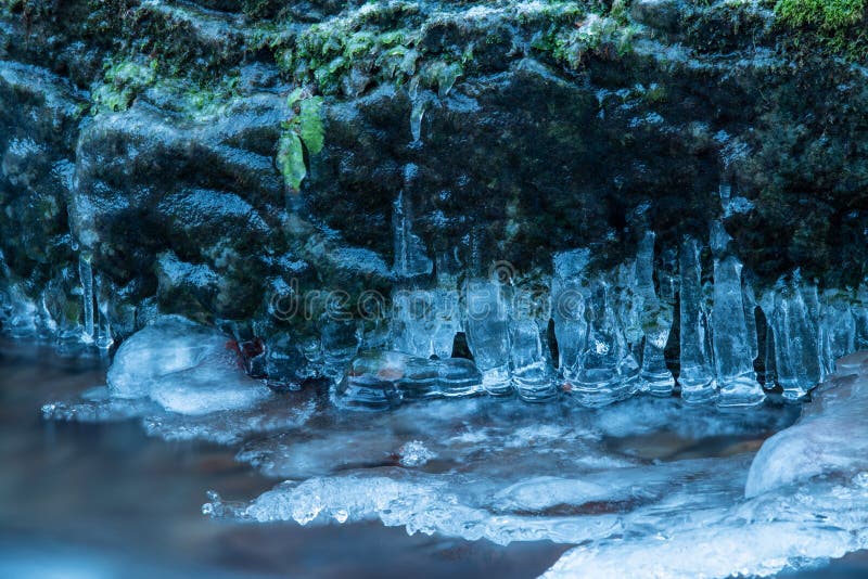 Close Up of Frozen River Rocks. Icicles and Frozen Water Textures ...