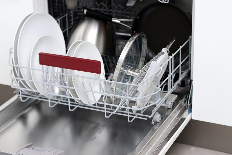 Close Up of a Full Dishwasher with Clean Plates, Lids, Glassware in the ...