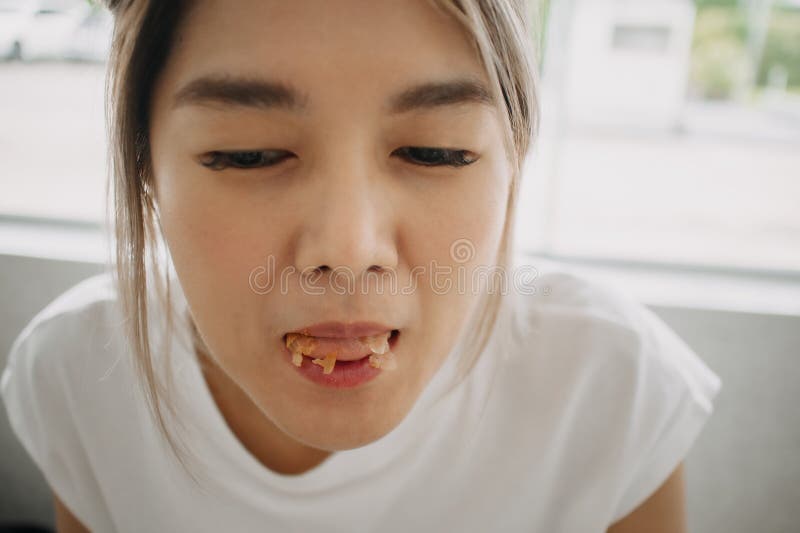 Close Up Funny Face Of Woman Eating Cake In The Cafe Stock Image