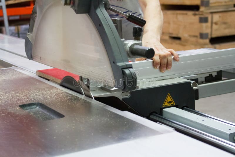 Close-up of a Furniture Workshop Worker Sawing a Workpiece with a ...