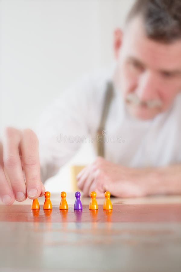 Close-up of Game Pieces on Table and Businessman Stock Photo - Image of ...