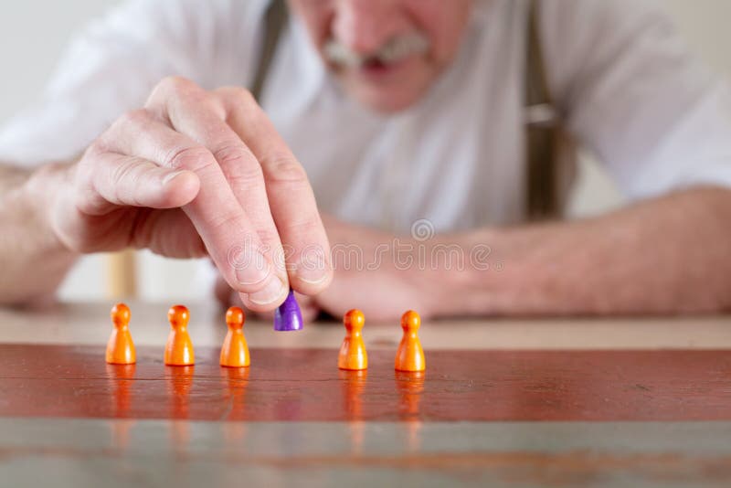 Close-up of Game Pieces on Table and Businessman Stock Photo - Image of ...