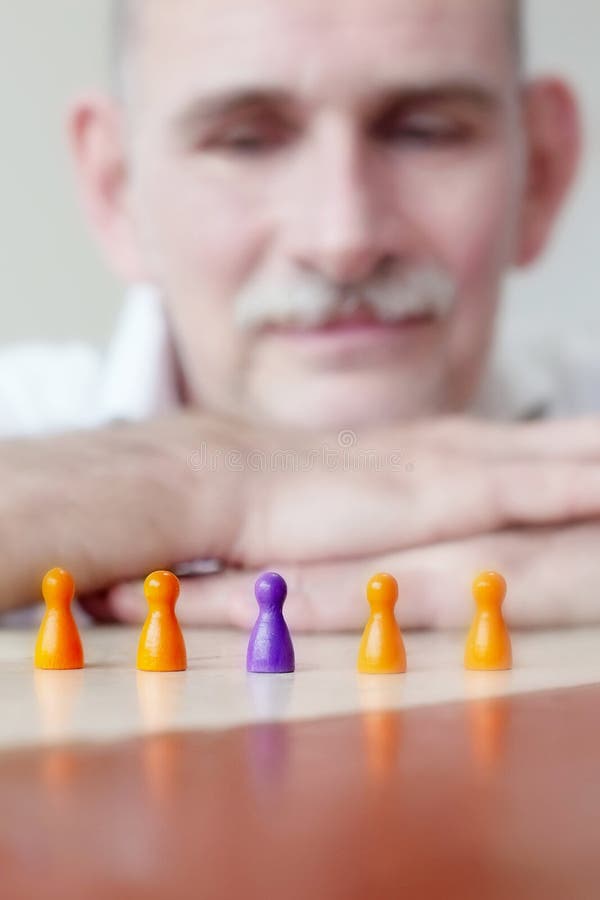 Close-up of Game Pieces on Table and Businessman Stock Photo - Image of ...