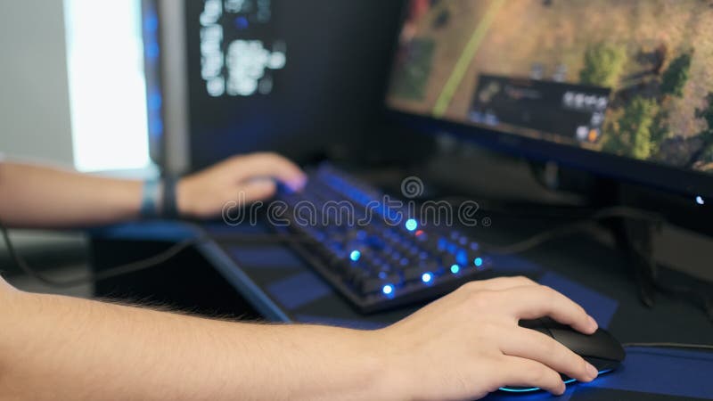 Close-up of Gamer Using a Computer with Blue Backlit Keyboard Stock ...