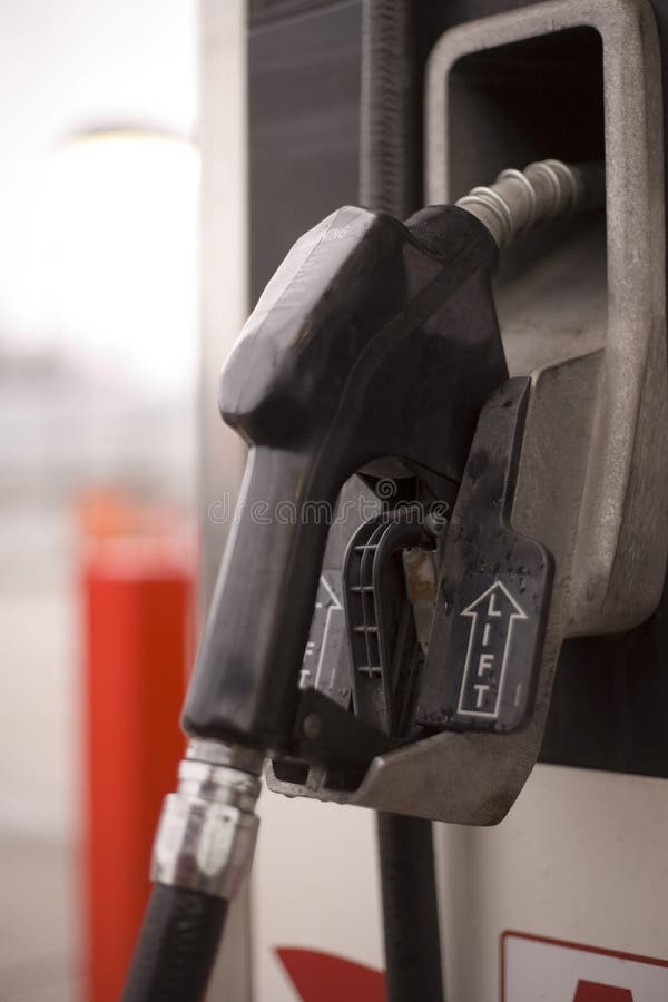 Gas Pump with Money in the Nozzle Stock Image - Image of fuel, road ...
