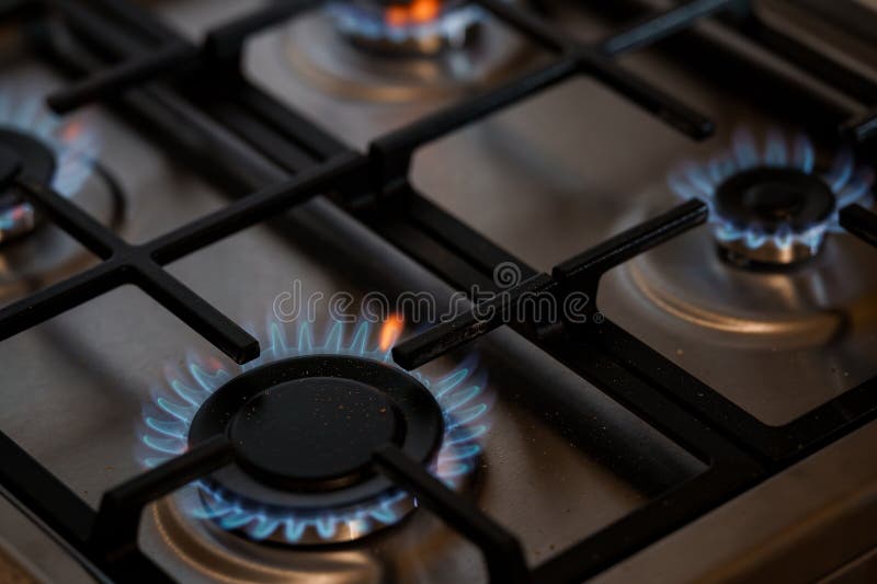 Close-Up of a Gas Stove with Flames Igniting for Cooking Stock Image ...
