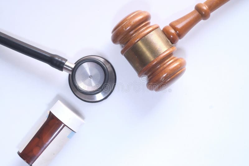 Gavel and Stethoscope on Reflective Table Stock Image - Image of ethics ...