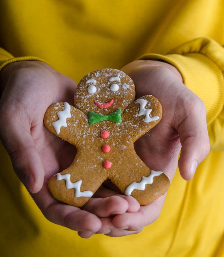 Close-up Gingerbread Man in the Hands of a Boy Stock Photo - Image of ...