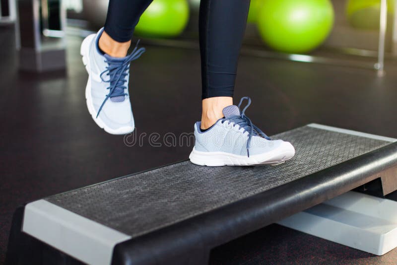 Close Up, Girl Performs Step Cardio with Dumbbells in a Gym Stock Photo ...