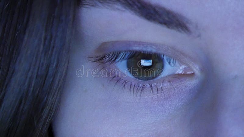 Close Up of Girl`s Eye Reading Internet, with Reflection of Screen in ...