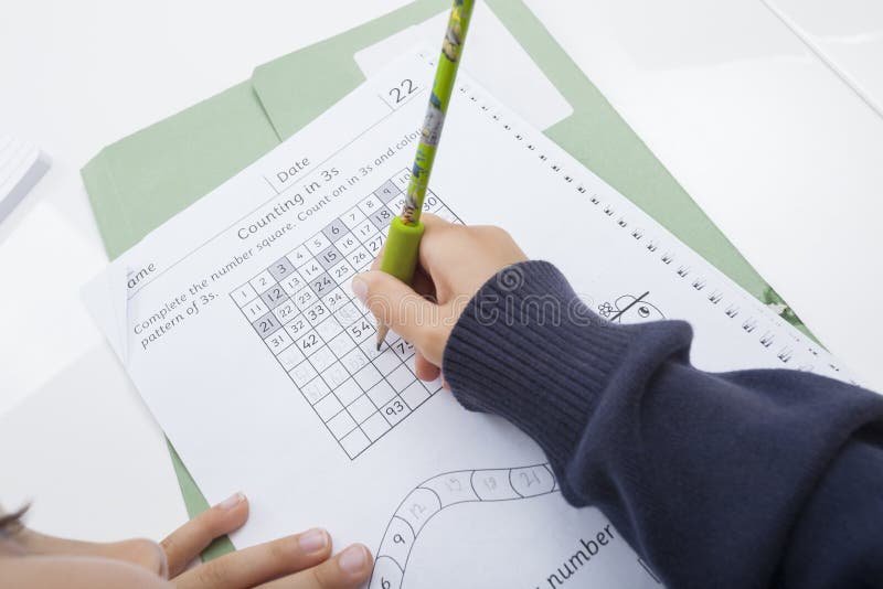 Close-up of Girl S Hand Writing Numbers on Document Stock Photo - Image ...