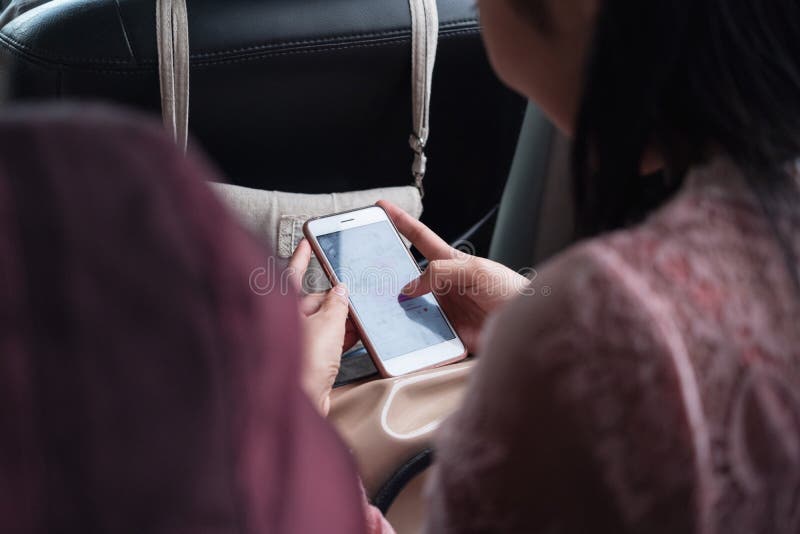 Close Up Girl Using Smart Phone from Behind Stock Image - Image of ...