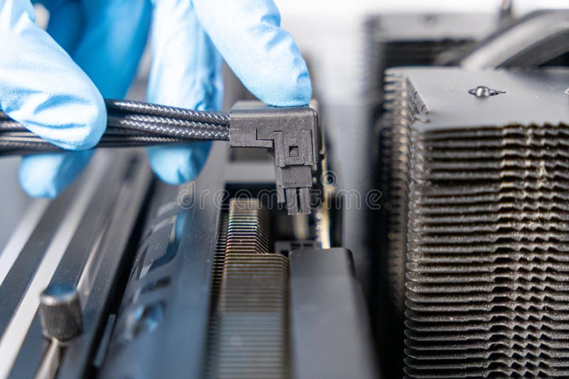 Close-up of Gloved Hands Aligning 16-pin Power Cable Connector with ...