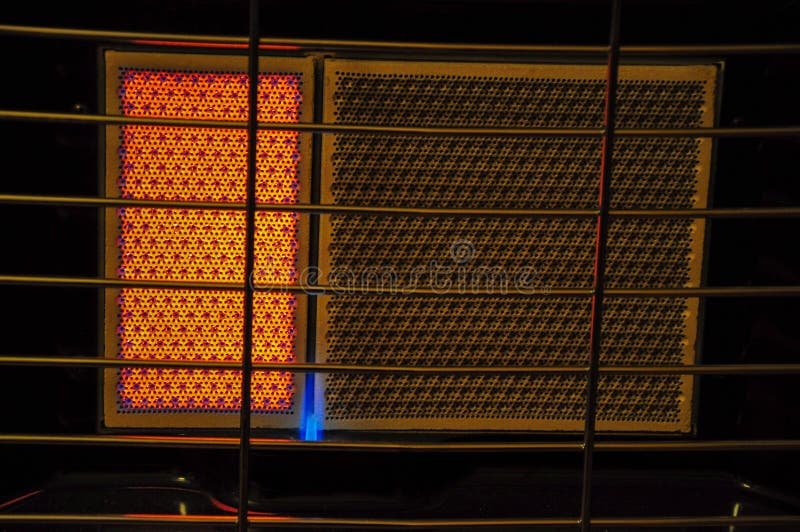Close-up of Glowing Electric Heater with Metal Grille, Warm and Cool ...