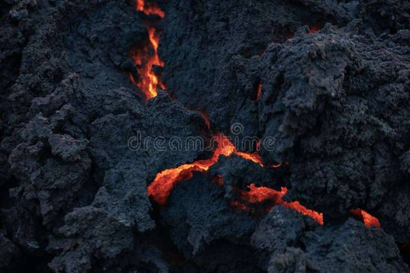 Close Up Glowing Lava Cracks Volcanic Rock Formation Stock Photos ...