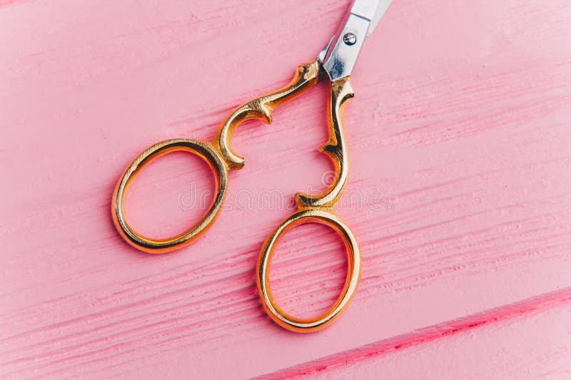 Close-up of Gold-tipped Iron Scissors on Pink Boards. Scissors for ...