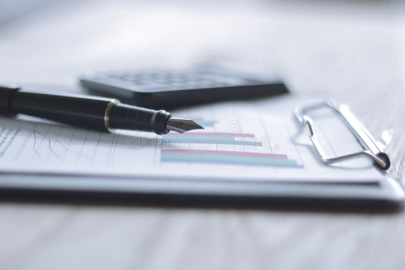 Close Up. Gold-tipped Pen and Financial Chart on the Table Stock Image ...