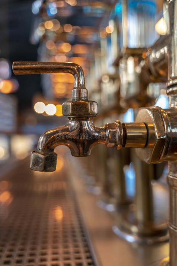 Close-up of Golden Beer Pump Inside a Brewery Stock Image - Image of ...