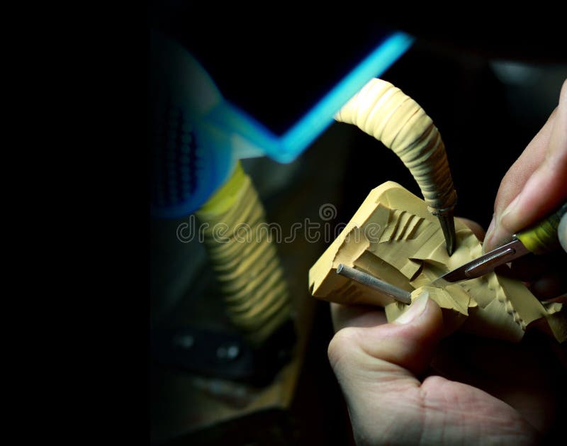 Close Up Goldsmith Cutting Rubber Mold in Jewelry Process Unfinished ...