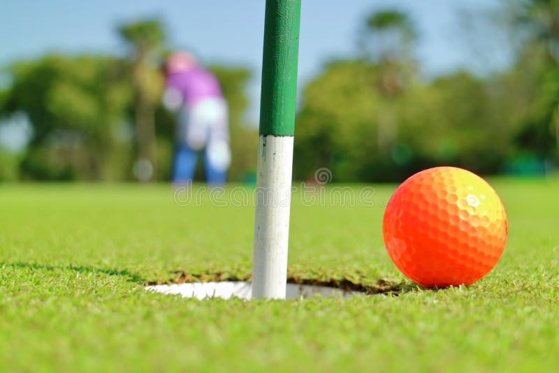 Close Up Golf Hole and a Ball on Green Grass Golf Course. Stock Photo ...