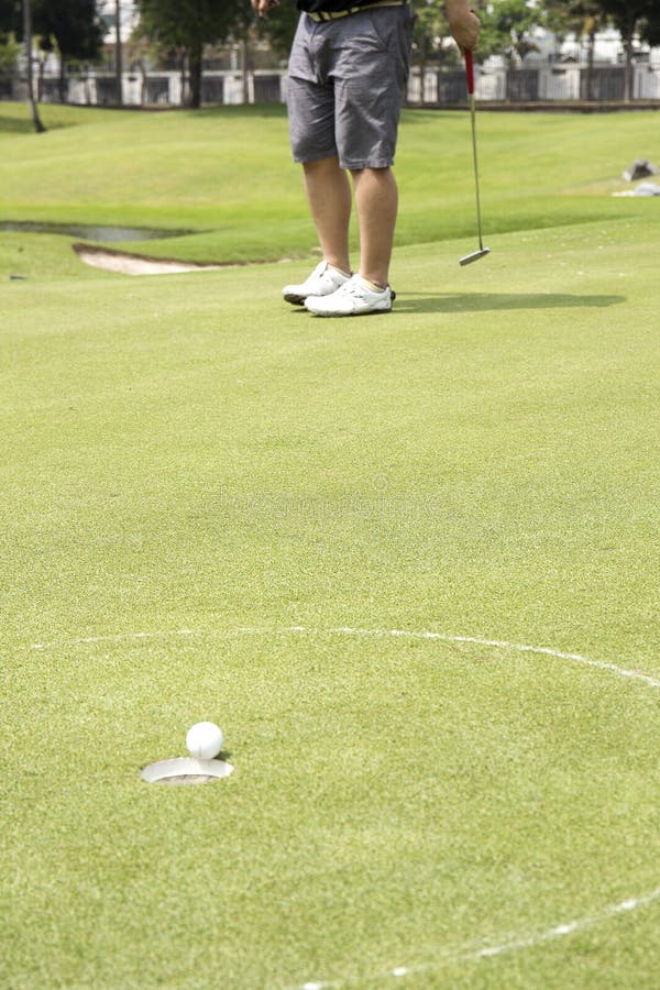 Close Up Golf Player Putting Ball Stock Image - Image of putter, hole ...