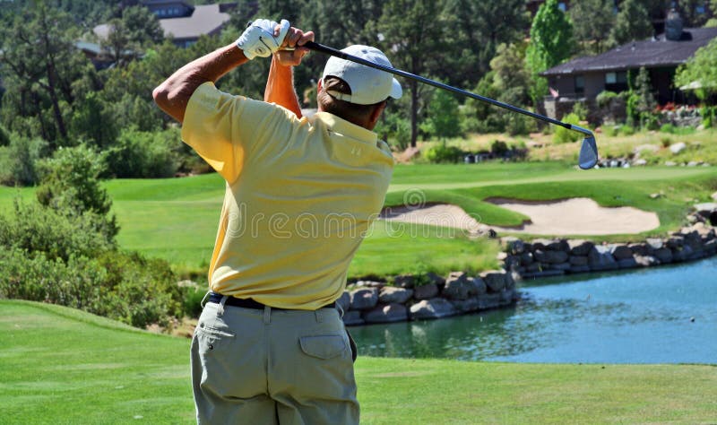 Close-up of a Golfer Hitting Over Water Stock Photo - Image of grass ...