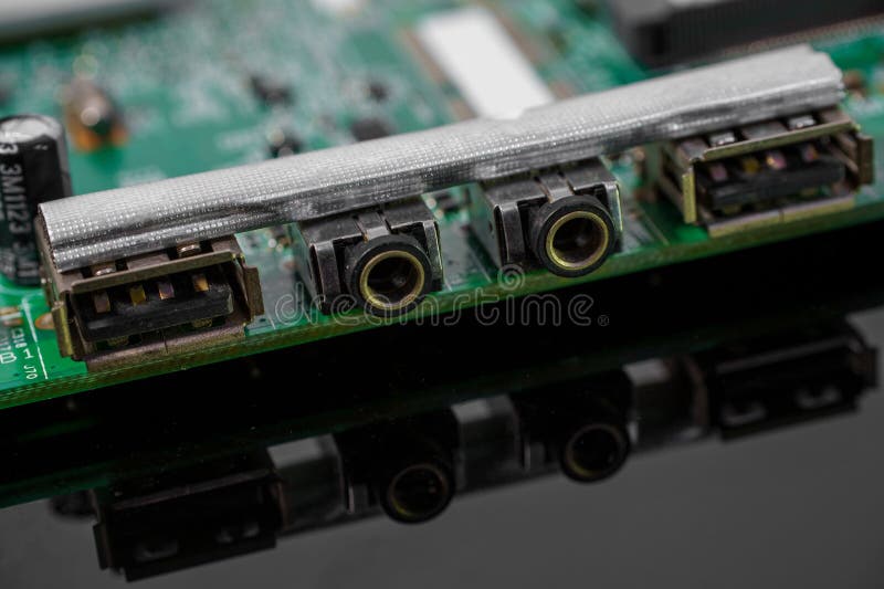 Close-up of a Green Circuit Board with Connectors and a Ribbon Cable ...