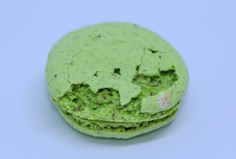 The Close Up of Green Macaron with Broken Crusty Shell. Stock Photo ...