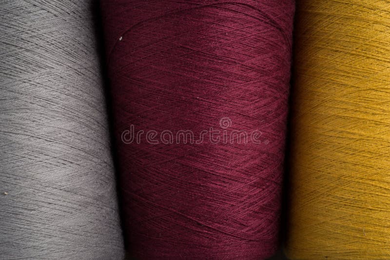 Close Up of Grey, Maroon, and Yellow Sewing Thread Stock Image - Image ...