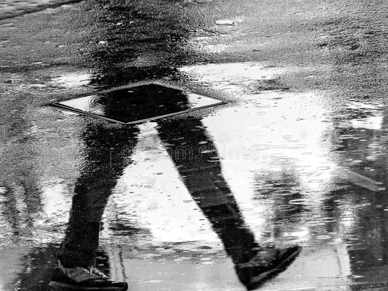Close Up Grey Scale Shot of a Human Silhouette Reflected on the Wet ...