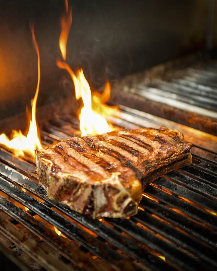Close-up of a Grilled Beef Steak on a Barbecue Grill with Flames Stock ...
