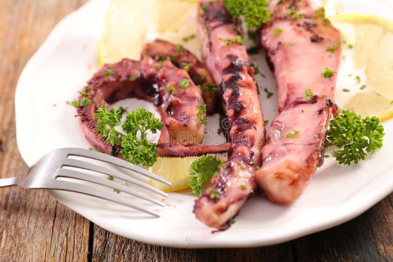 Grilled octopus and lemon stock image. Image of eating - 127054297