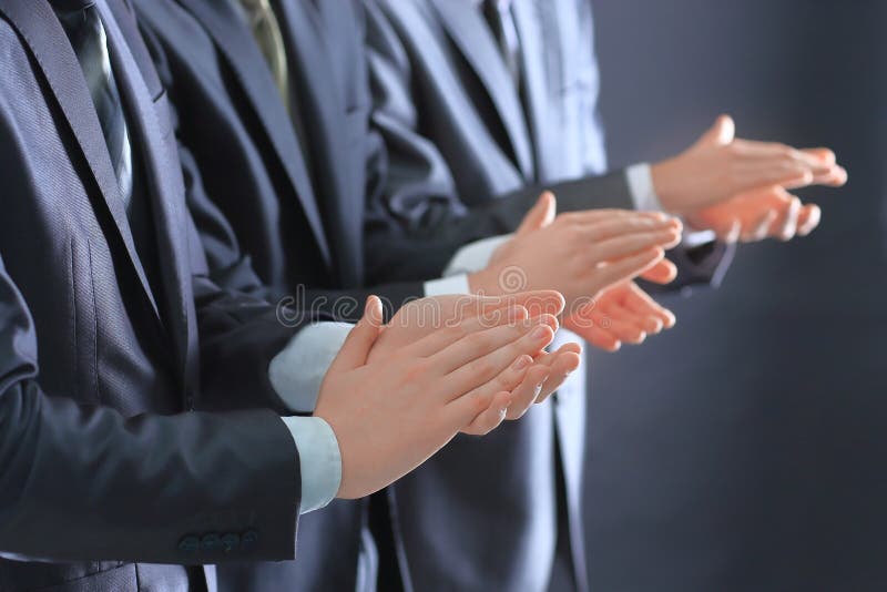 Close Up.a Group of Business People Applauding Standin Stock Image ... Close Up.a Group of Business People Applauding Standin Stock Image ...
