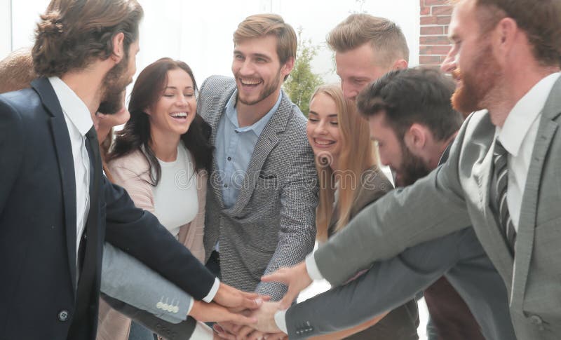 Close Up. a Group of Corporate Employees Showing Their Unity Stock ...