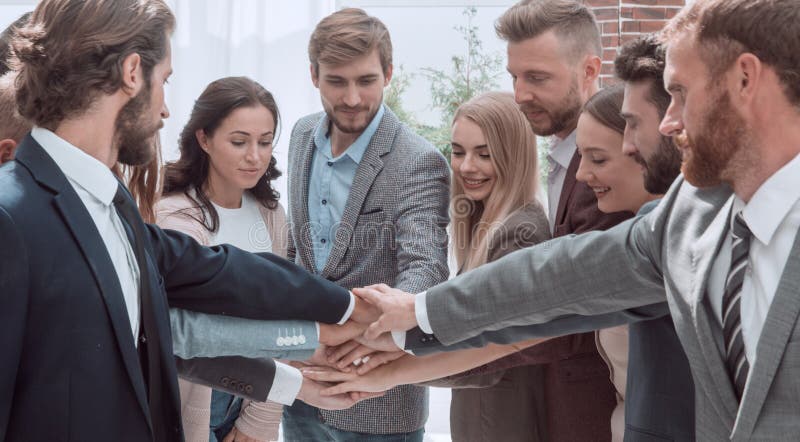 Close Up. a Group of Corporate Employees Showing Their Unity Stock ...