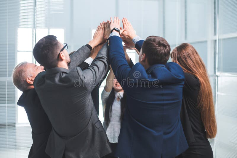 Close Up. a Group of Corporate Employees Showing Their Unity Stock ...