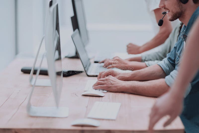 Close Up. a Group of Designers Working on Personal Computers Stock ...