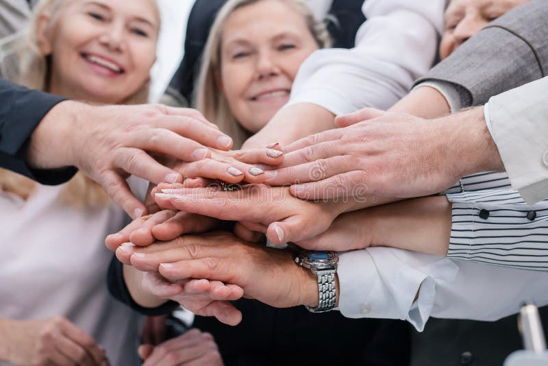 Close Up. a Group of Diverse Employees Joining Their Palms Together ...