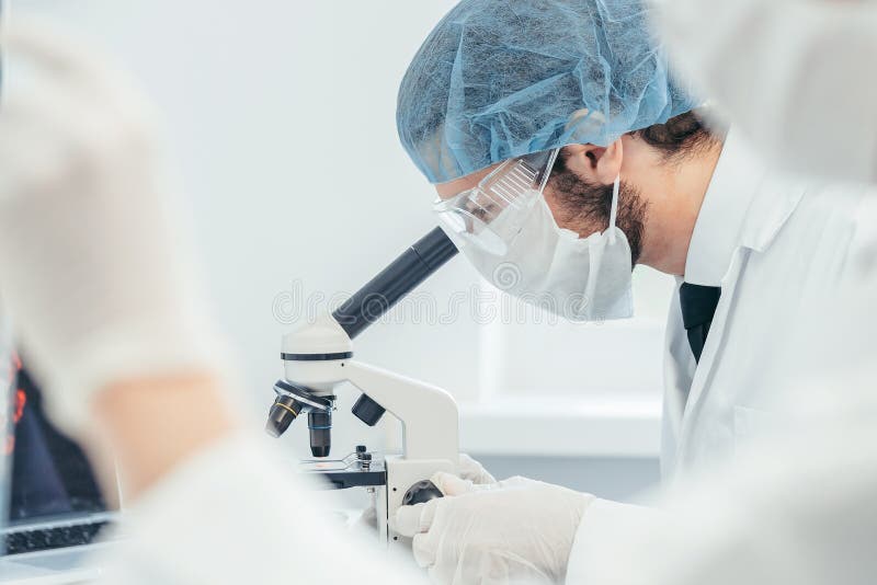 Close Up. a Group of Doctors and Scientists Work in the Laboratory ...