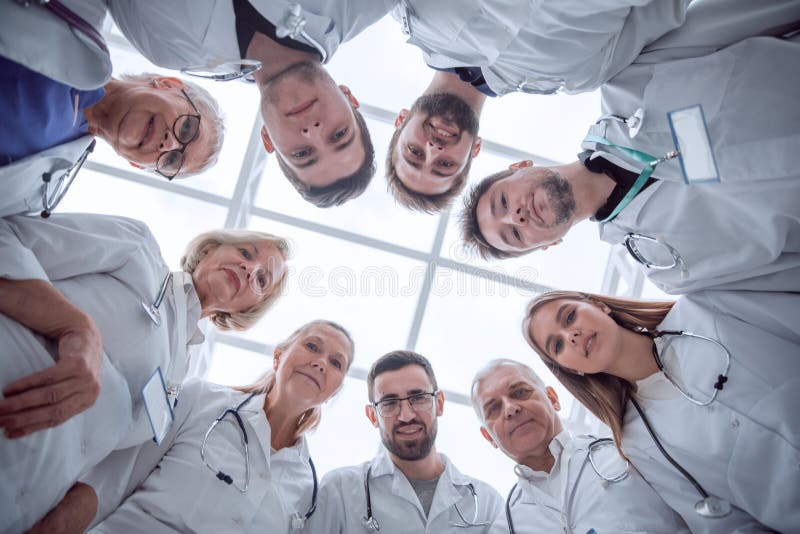 Close Up. Group of Doctors Standing in a Circle and Looking at You ...
